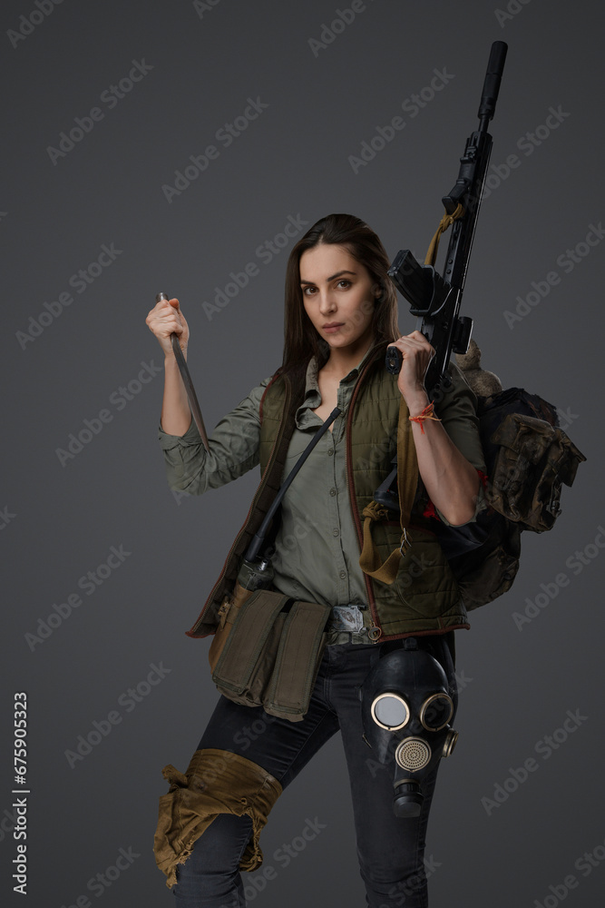 Middle Eastern woman, dressed in post-apocalyptic survivalist gear ...