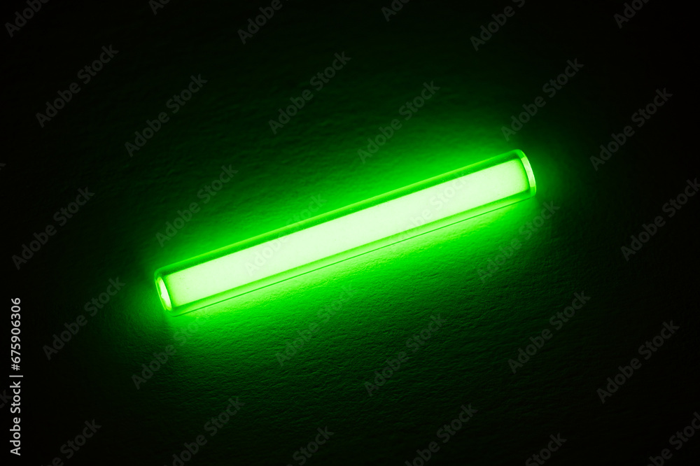 Tritium. Radioactive glow. Gaseous tritium light source in a glass vial ...