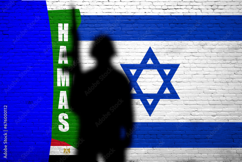 Israel, Egypt and Hamas flag map painted on a brick wall with soldier ...
