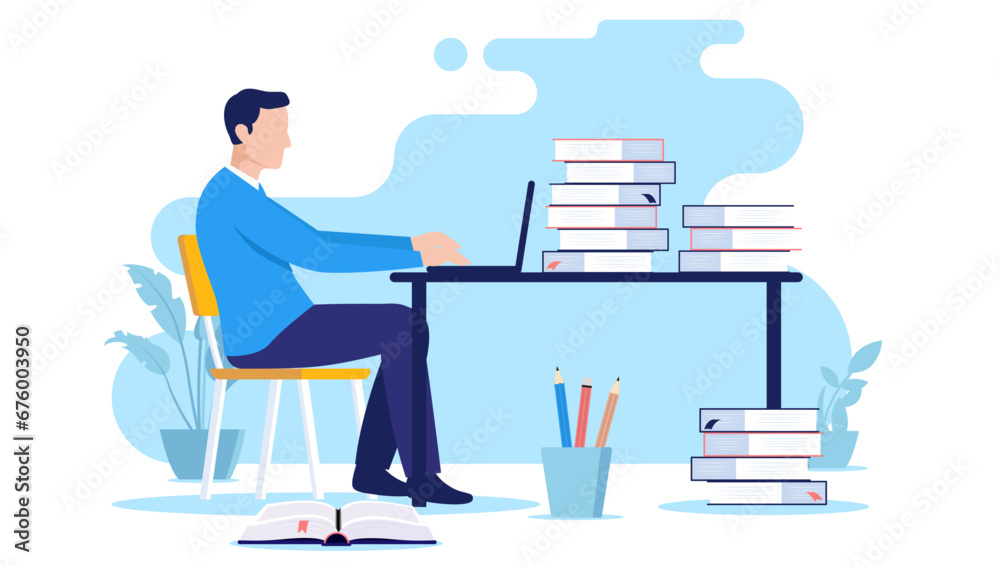 Male student sitting at desk with laptop and books studying and ...