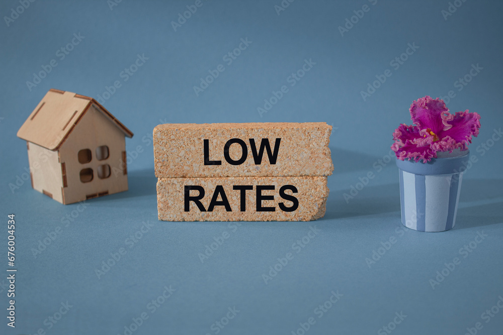 Low house rates symbol. Concept red words Low rates on brick blocks ...