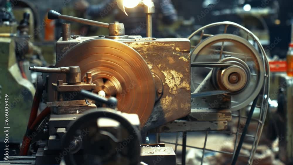 Operating a lathe machine in a light engineering workshop in Bangladesh ...