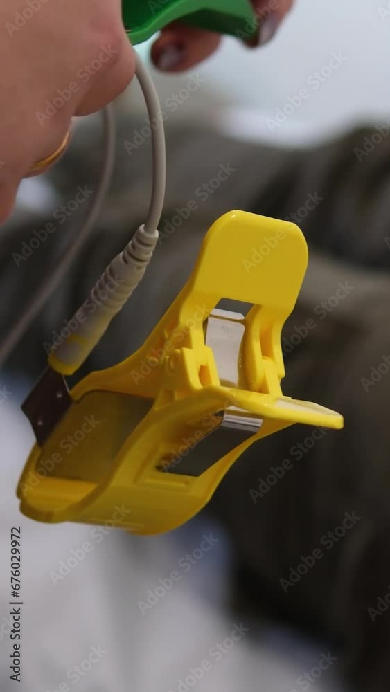 cardiogram in the hospital woman doctor examines a man patient puts ...