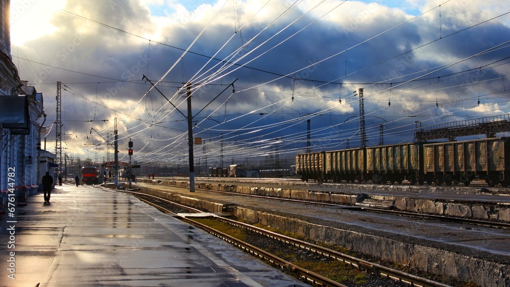 railway tracks and pyron after rain. The photo shows cloudy weather but ...