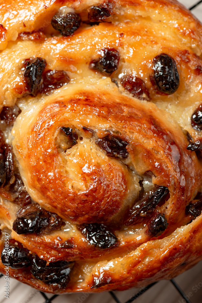 Pain aux raisins, also called escargot or pain russe, is a spiral ...