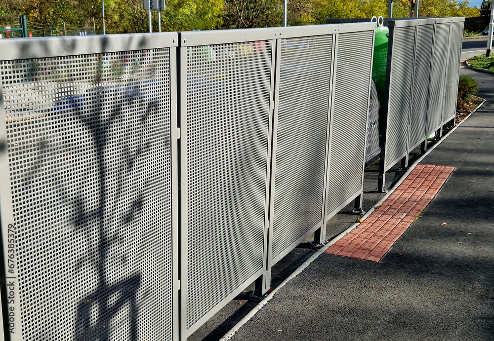yard for placing containers for sorting household waste. gray door and ...