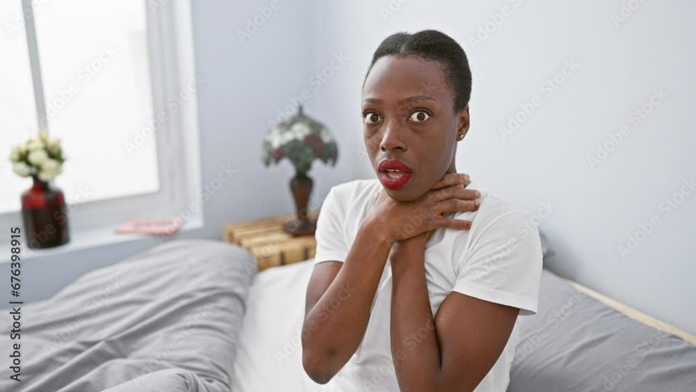African american woman in agony lying on bedroom bed, suffocating from ...