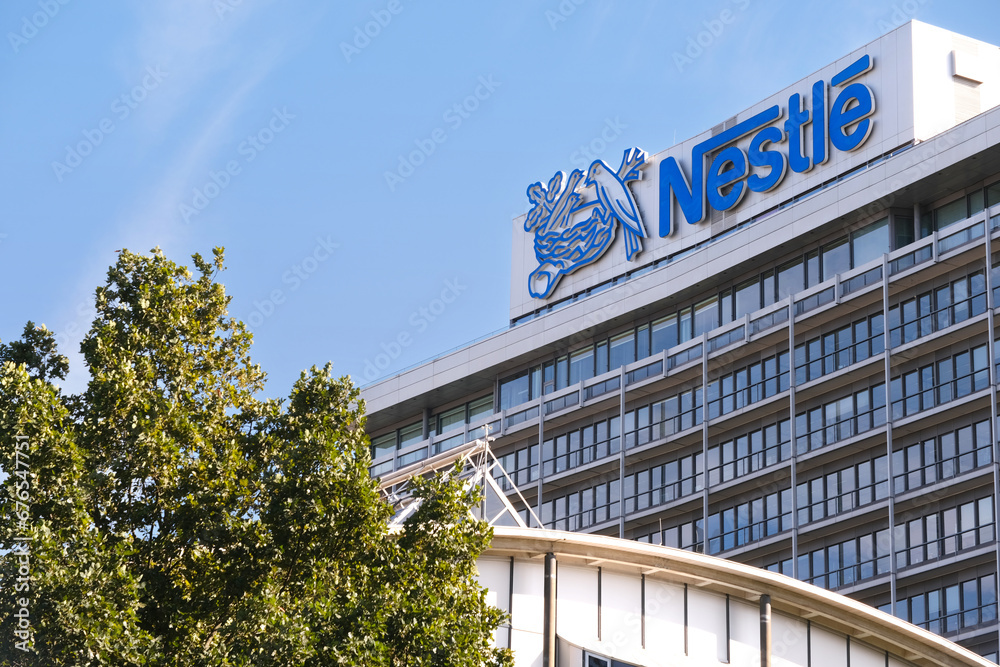 office with logo Nestle, Anglo-Swiss condensed milk company, food ...