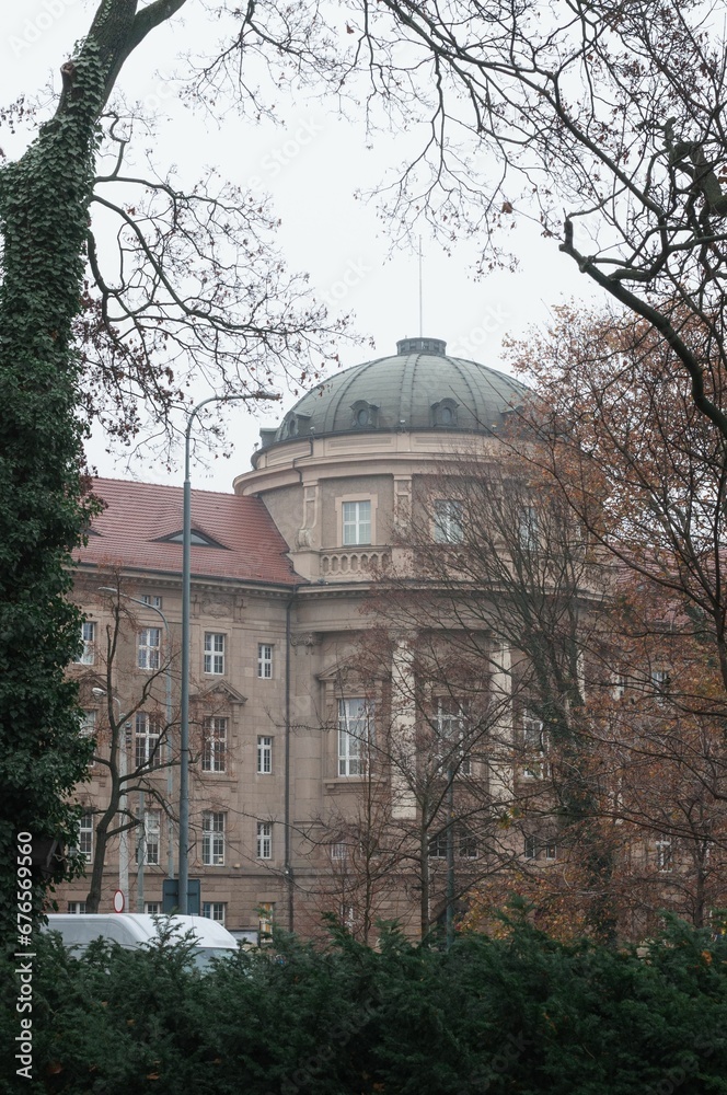 Vertical of the Collegium Maius school building on a gloomy, foggy day ...