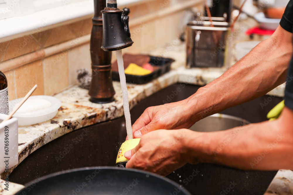 hand-washing dishes, symbolizing equality and shared responsibilities ...