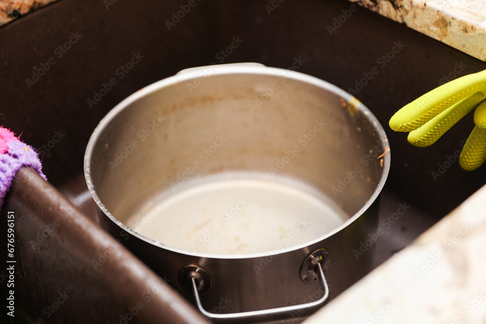 hand-washing dishes, symbolizing equality and shared responsibilities ...