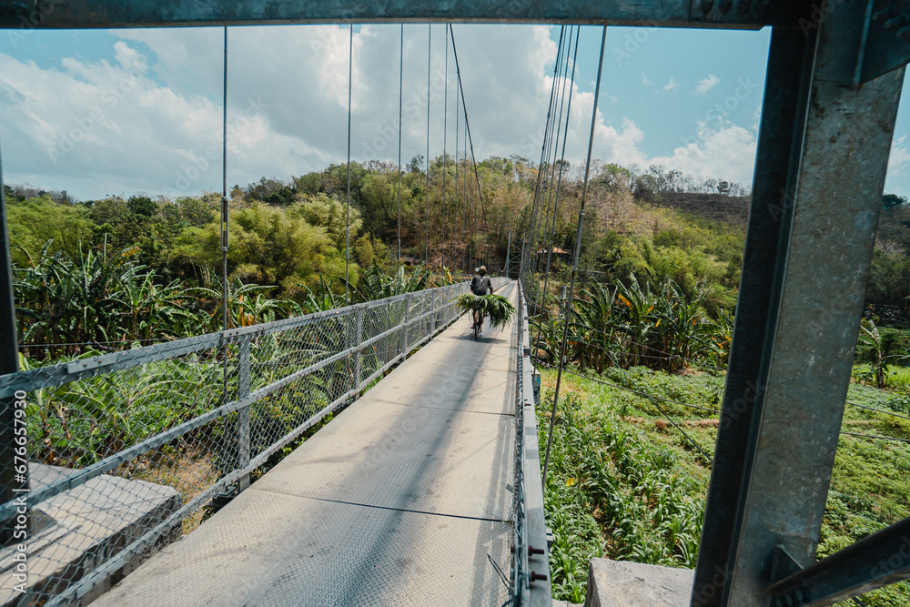 A suspension bridge that can only be used by two-wheeled vehicles and ...