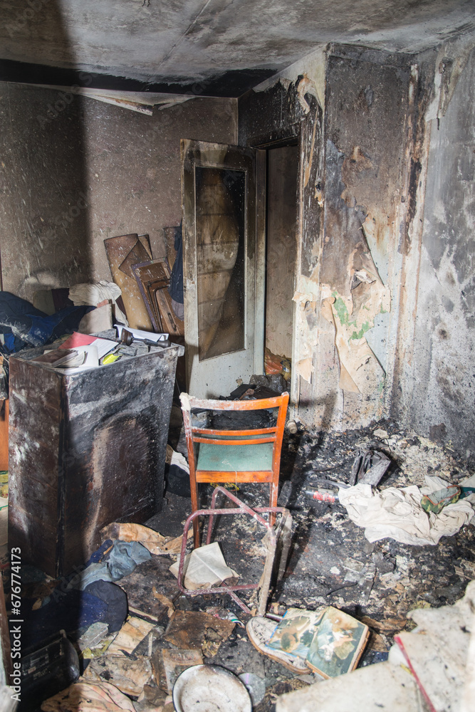 Consequences after a short circuit, burnt house interior, damaged ...