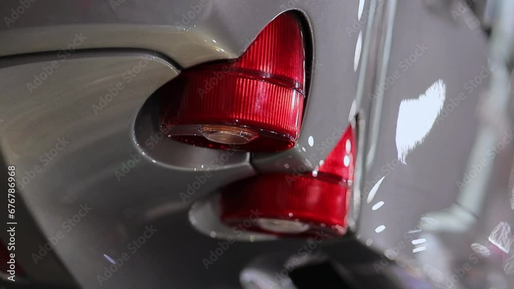 rear lights of a sports car. Large red round tail lights of a racing ...