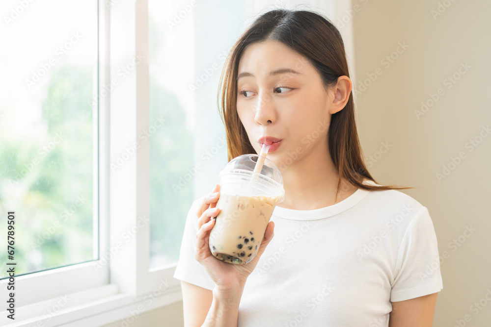 Beverage and food concept, Happy asian young woman hand holding plastic ...