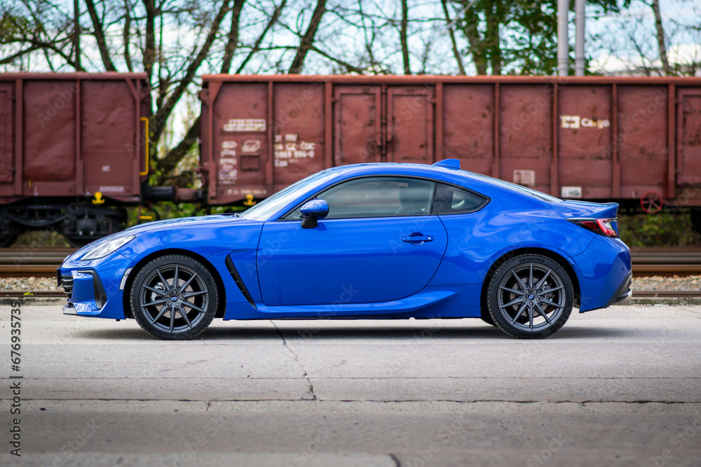 Blue sports car Subaru BRZ. Sports fast car at the station. Side view ...