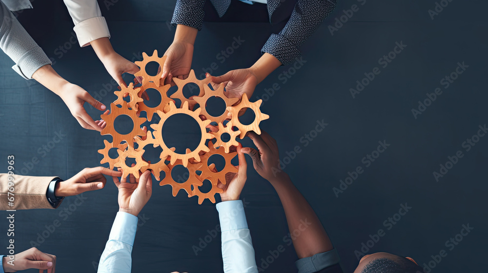 business people holding cog wheel as unity and teamwork in corporate ...