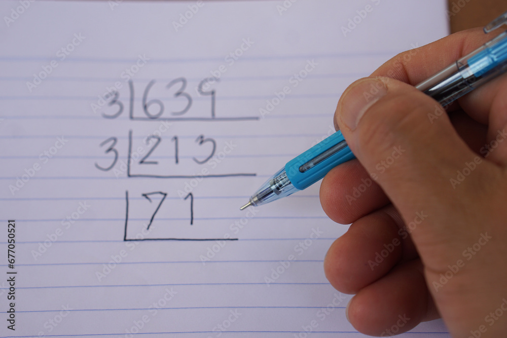 Handwriting with pen of steps of calculate numbers in mathematics ...