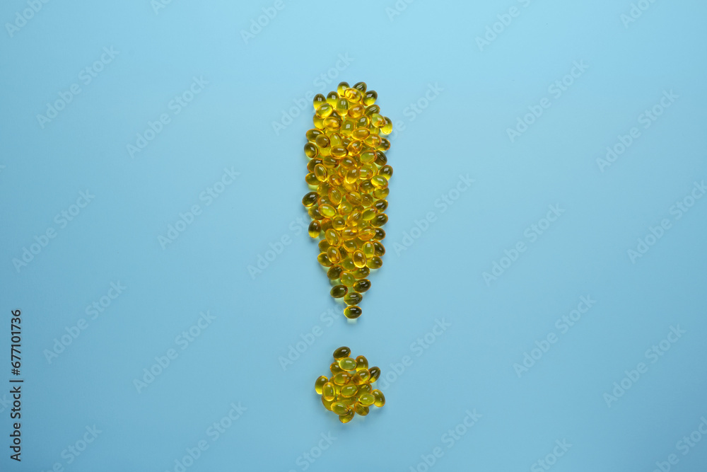Exclamation mark made of oil filled capsules suitable for: fish oil ...