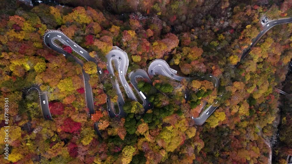 Aerial footage of Irohazaka winding roads connects the lower elevations ...