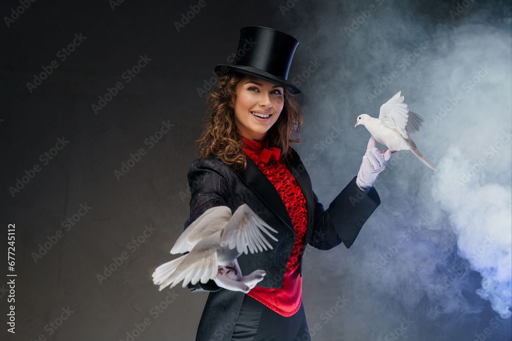 A bewitching moment captured as a woman magician in a magician's ...