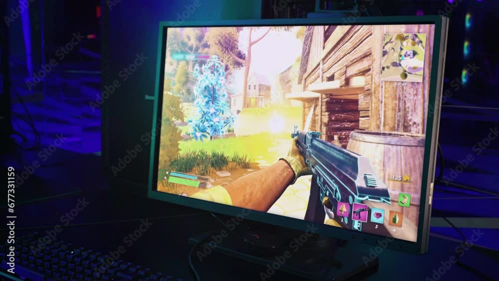 PC Monitor Shows Player Shooting Enemies In Fake Game Battle Royale ...