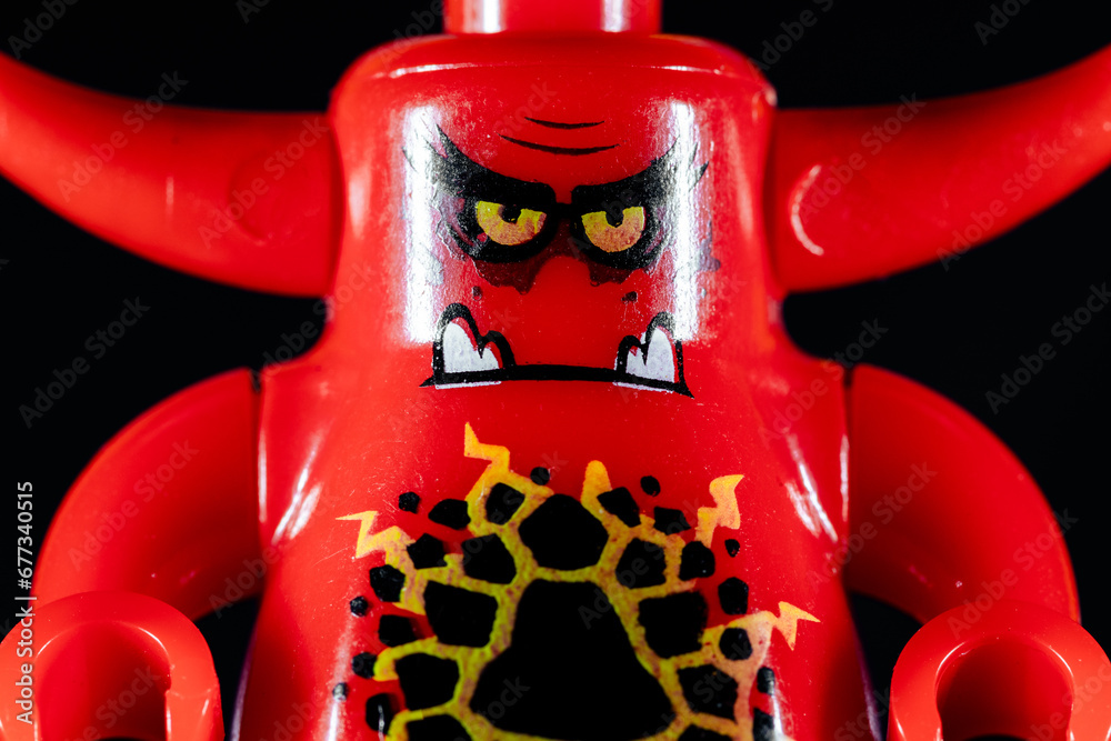 LEGO red demon with an evil face on a black background Stock Photo ...
