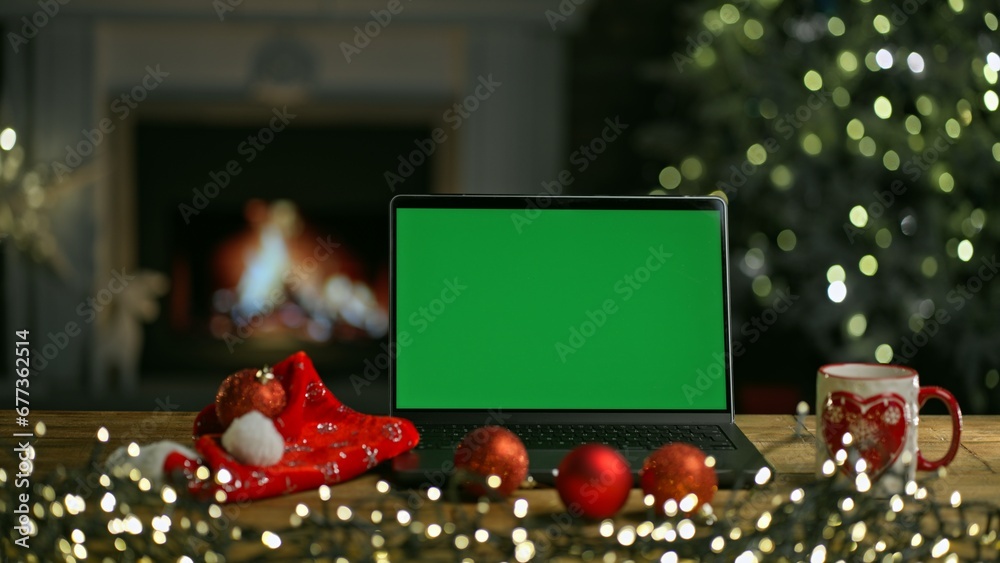 Laptop computer on desk at Christmas. Decorated room with Christmas ...