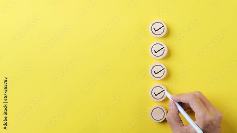 Checklist concept. Person using a black ink pen to correct sign and ...