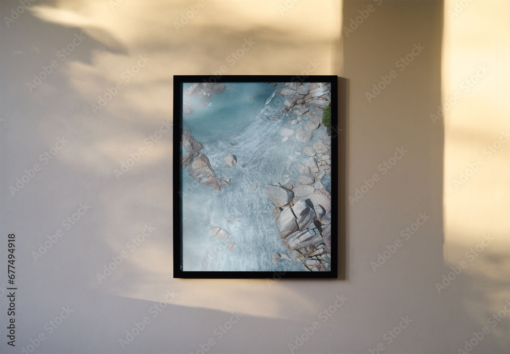 Mockup of vertical customizable A3 / A4 picture frame mounted on wall ...