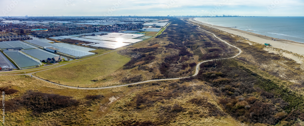 Panorama view of the dunes, beach, and the Westland greenhouses seen ...