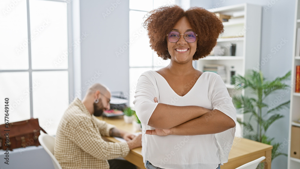 Captivating picture of two confident workers, a man and woman, standing ...