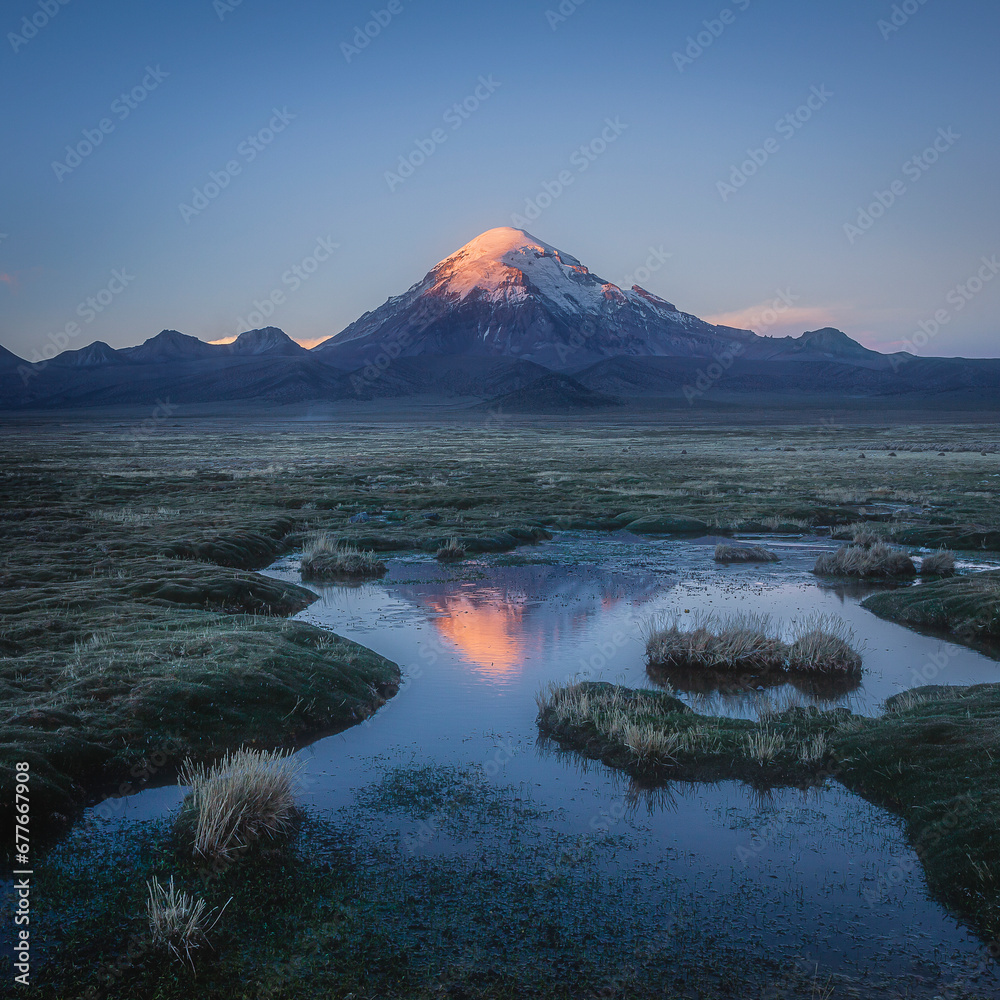 View of Nevado Sajama, an extinct stratovolcano with snow on top ...