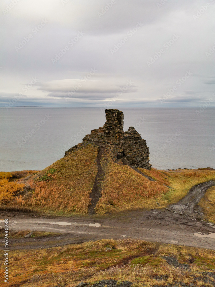 Two brothers rocks near Cape Zemlyanoi on the Kola Peninsula. Natural ...