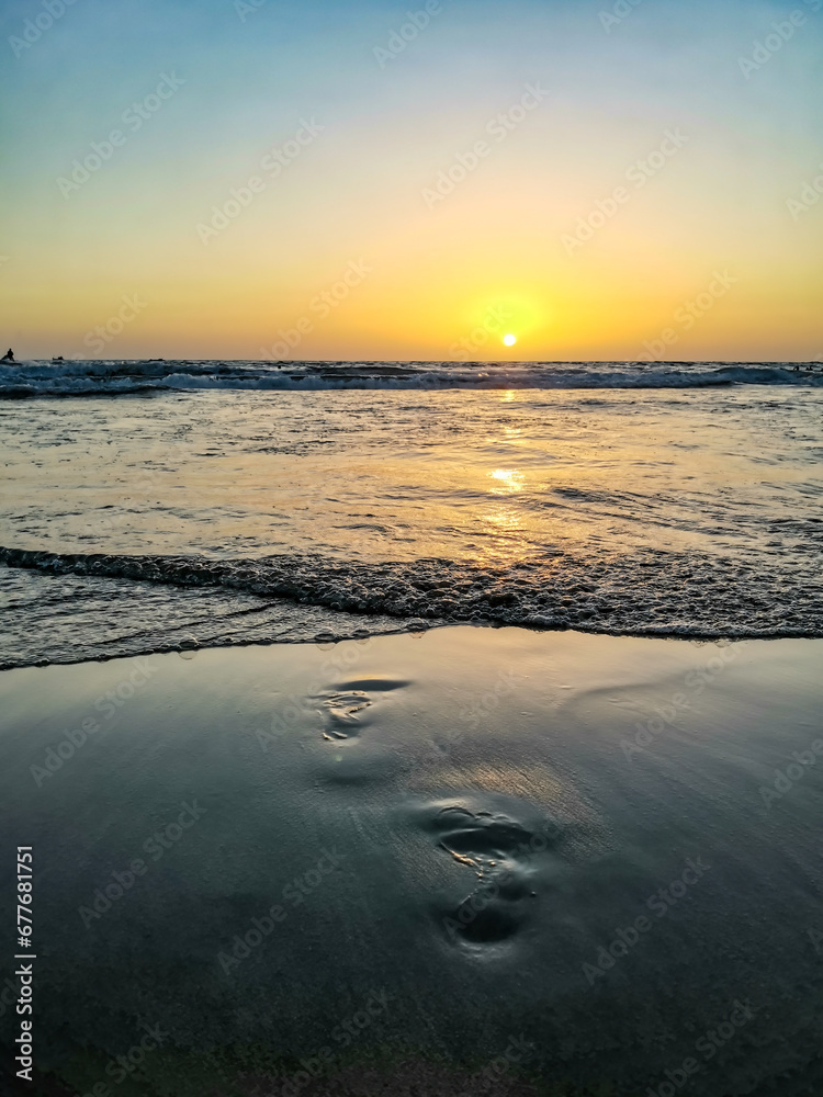 Sunset on Mandrem Beach in Goa, India. Bright and colorful sunset over ...