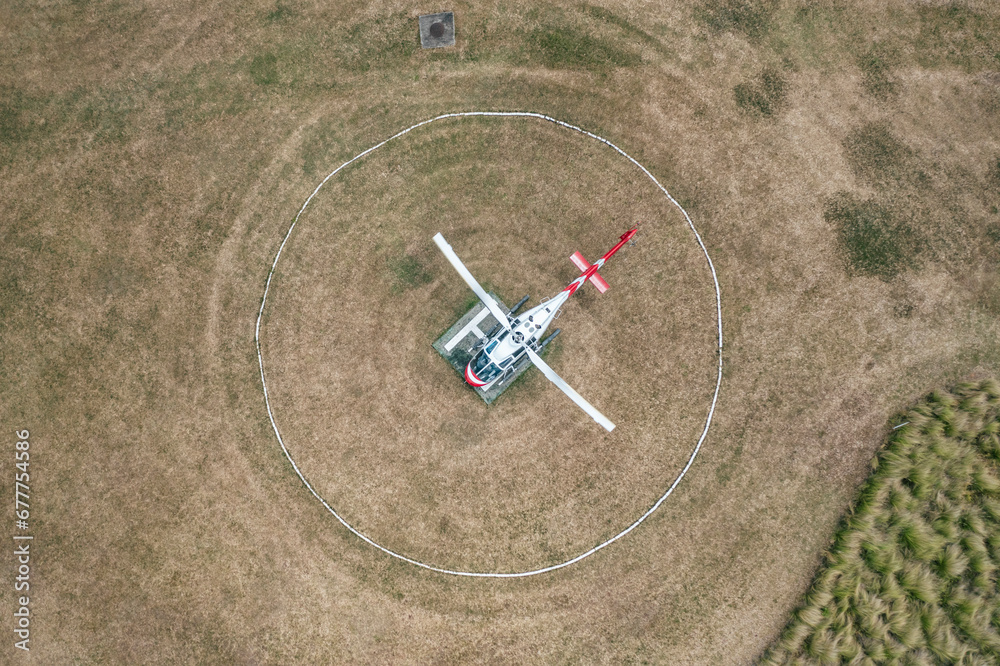 Aerial view of an helicopter ready for take off on a heliport in Bel ...