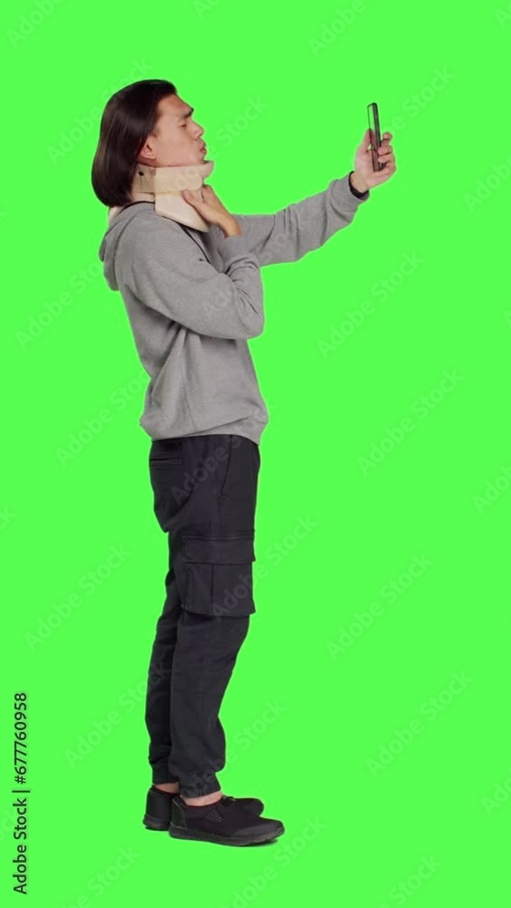 Profile of guy having cervical neck brace makes phone call informing ...