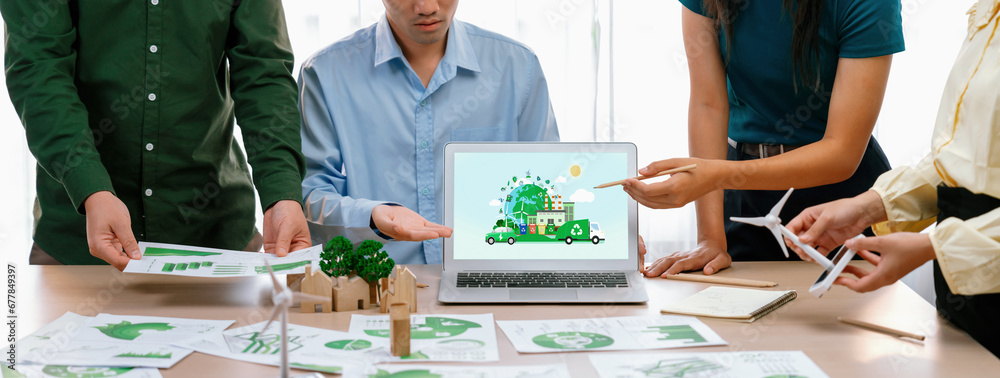 Green city and waste management illustrate displayed on laptop ...