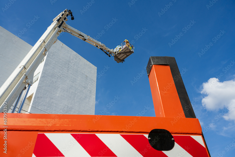 Firefighters in the fire truck crane rescue on building in the ...