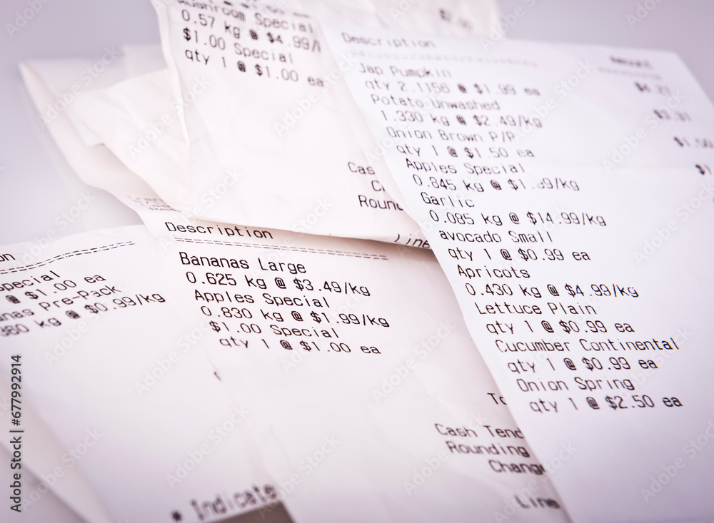 Grocery receipts for fruit and vegetables with costs shown in shallow ...