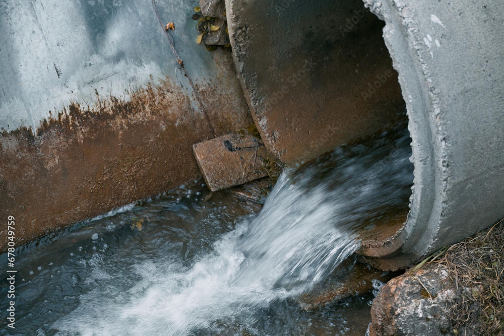 Draining sewage from a pipe into the river. Concept of pollution rivers ...