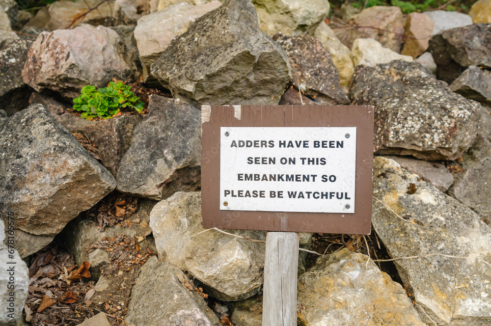 Sign warning the public that adders have been seen in the embankment ...