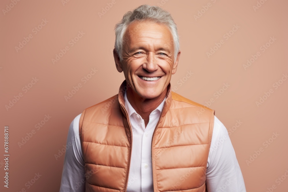 Portrait of a smiling man in his 60s dressed in a water-resistant gilet ...