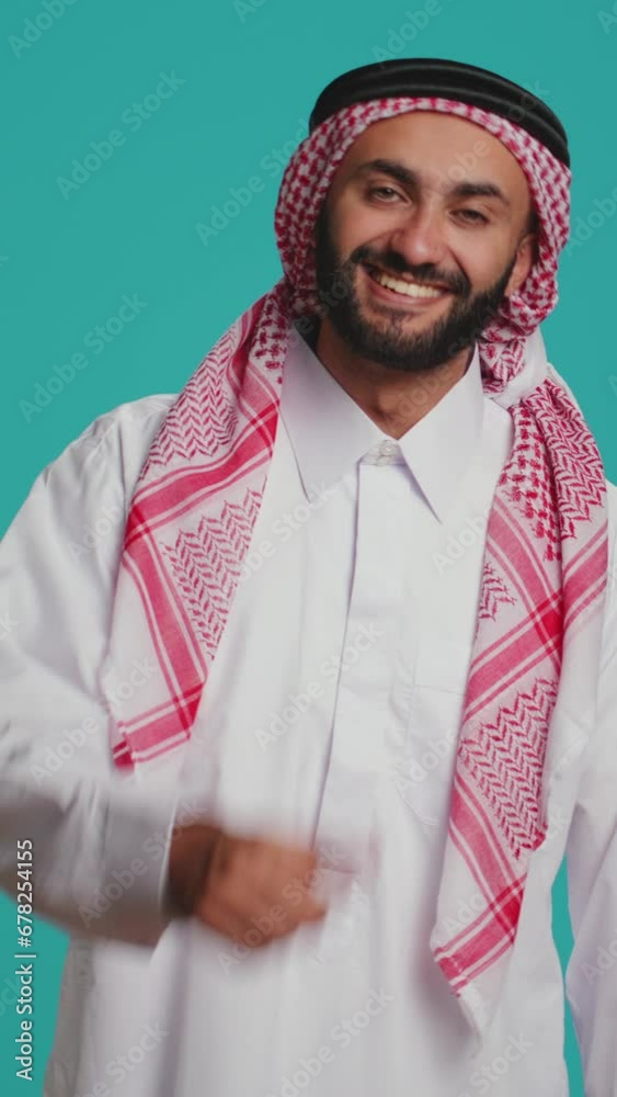 Vertical video Middle eastern man does thumbs up on camera, showing ... Vertical video Middle eastern man does thumbs up on camera, showing ...