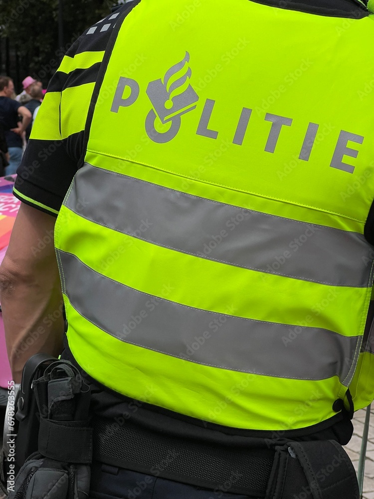 Tilburg, Netherlands - 24.07.2023: a police vest on the back of a dutch ...