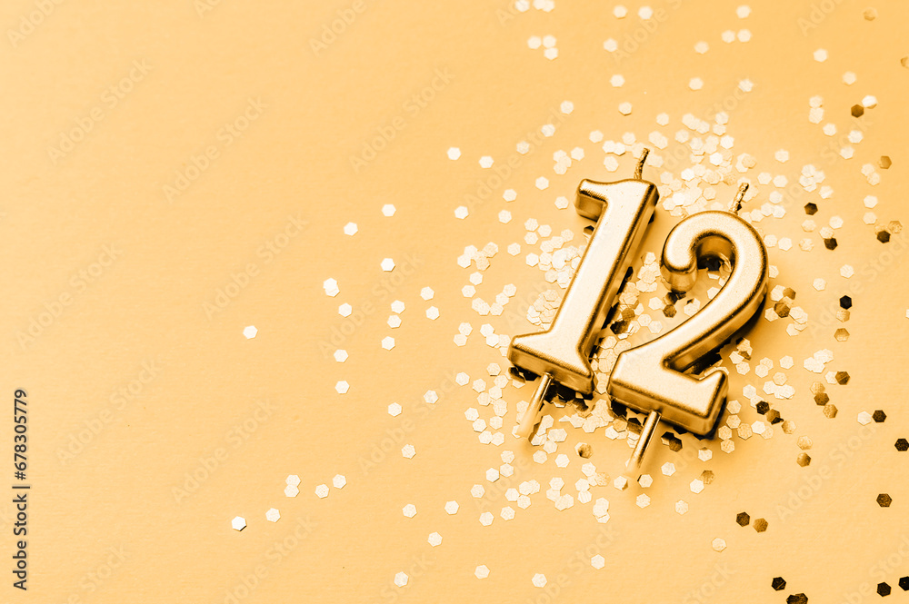 12 years celebration festive background made with golden candle in the ...