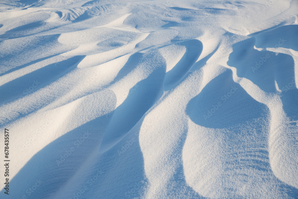 Snow texture. Wind sculpted patterns on snow surface. Wind in the ...
