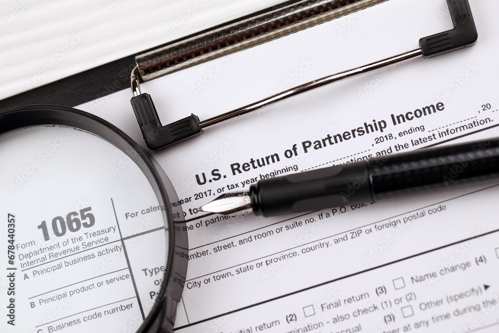 IRS Form 1065 US Return of Partnership Income blank on A4 tablet lies ...
