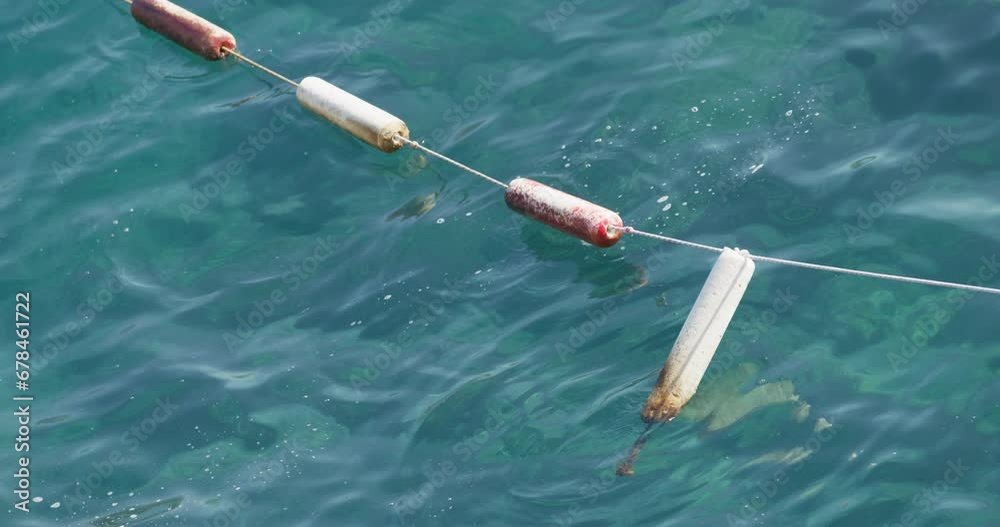 Fencing buoy on rope separating beach safe beach area for swimming Old ...