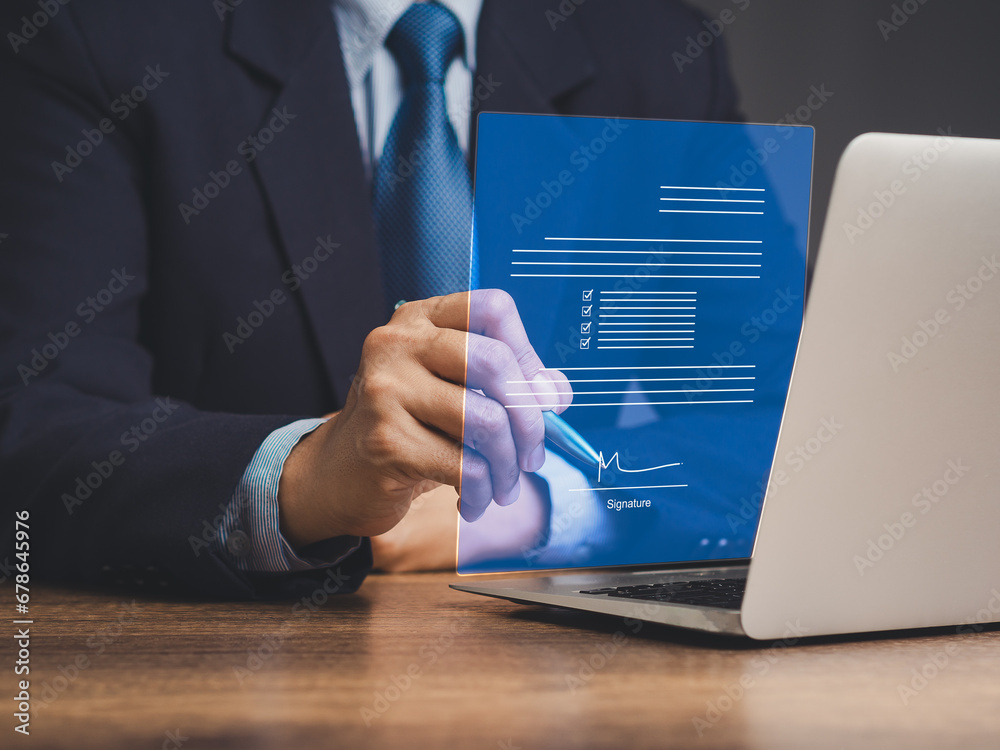 Businessman signs an electronic contract agreement on a virtual screen ...